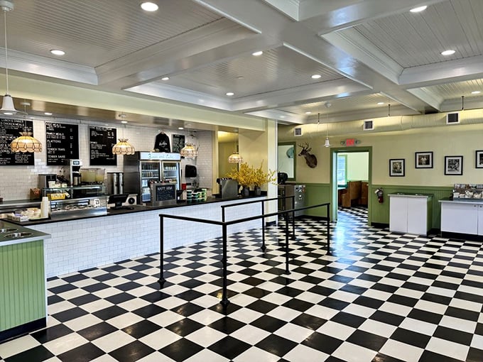 Step into a time machine with that classic black and white checkered floor. The bright, airy interior feels like the diner of your dreams—if your dreams specialized in perfect fried chicken.