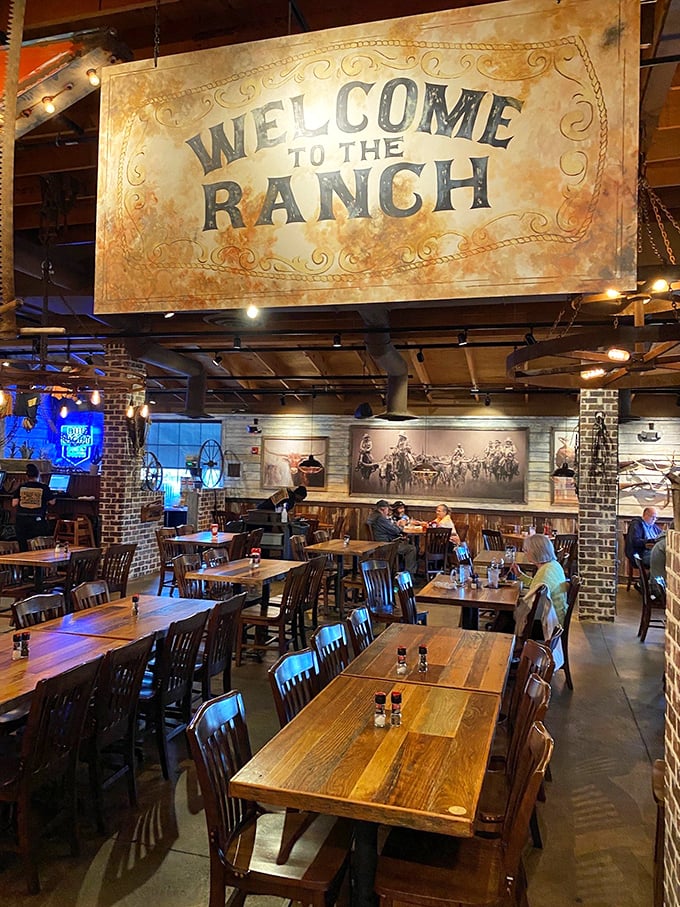 "Welcome to the Ranch" indeed! The dining room's warm wood tables, western décor, and strategically placed lighting create the perfect backdrop for meat-centric memories.