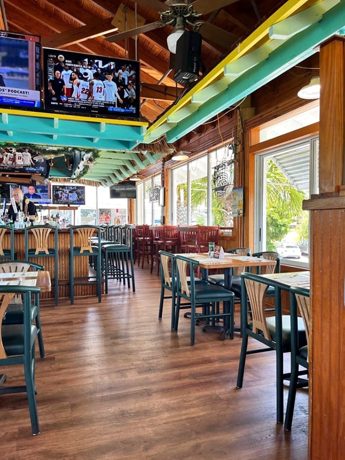 Turquoise beams and wooden accents create that perfect "coastal casual" vibe where both flip-flops and fancy shoes feel equally at home.