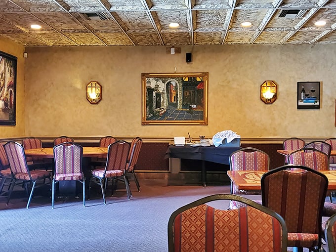 Warm amber walls, ornate tin ceilings, and cozy seating create that rare atmosphere where you instantly know the food will match the ambiance—authentically Italian.