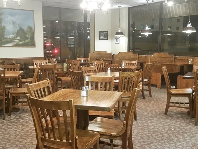 Wooden chairs and tables create a homey atmosphere where conversations flow as freely as the sweet tea, inviting diners to settle in and stay awhile.