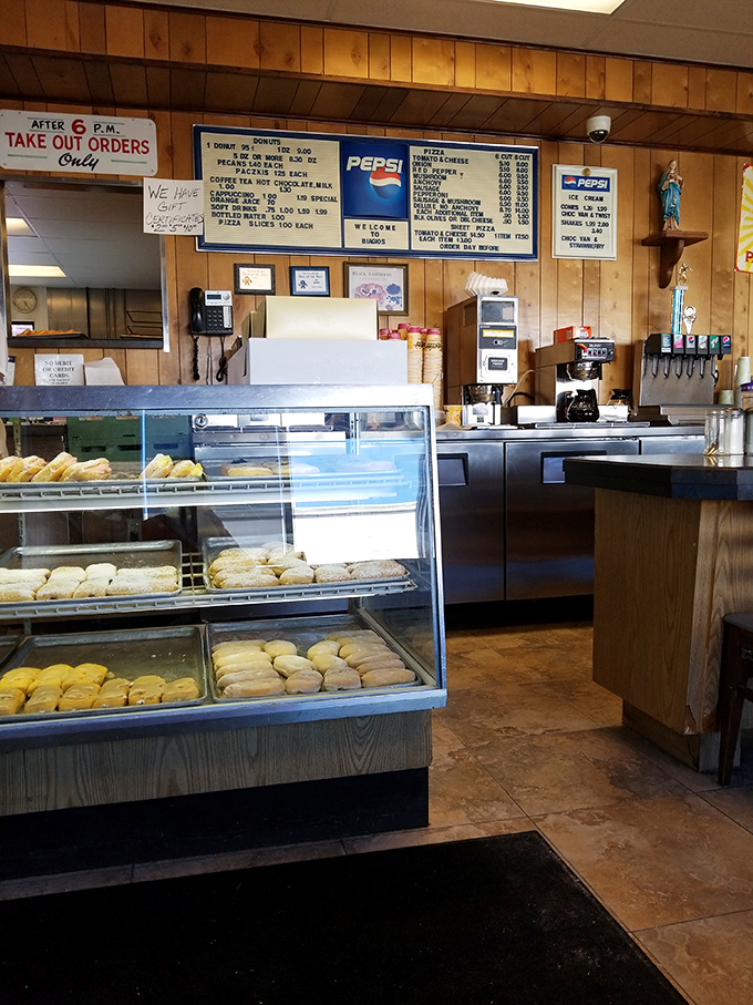 Wood-paneled walls and no-nonsense display cases—this is donut heaven without the Instagram filters, where substance triumphantly trumps style.