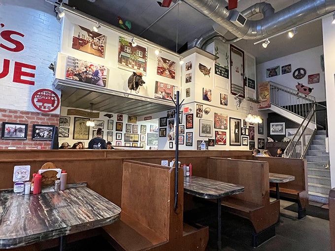 History hangs on every inch of wall space, creating a museum of barbecue memories where every booth feels like the best seat in the house.