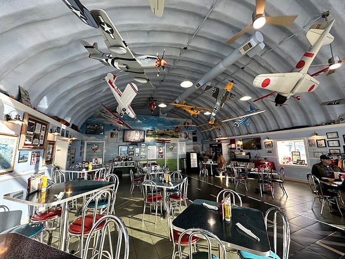 Look up! The ceiling of Hangar Kafe doubles as an aviation museum, with meticulously detailed model planes suspended above diners—breakfast with a side of history.