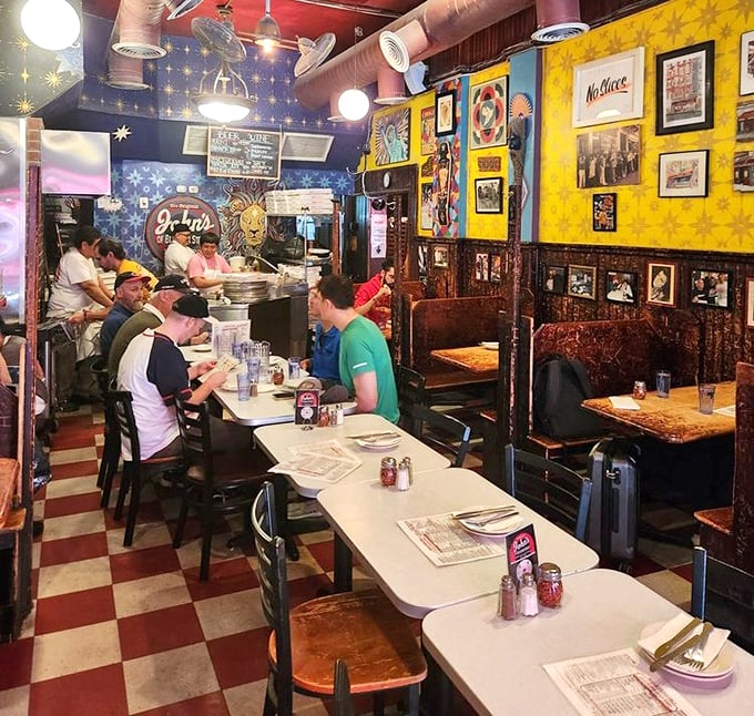 Inside, the checkerboard floor and colorful walls create a time capsule where conversations flow as freely as the draft beer.