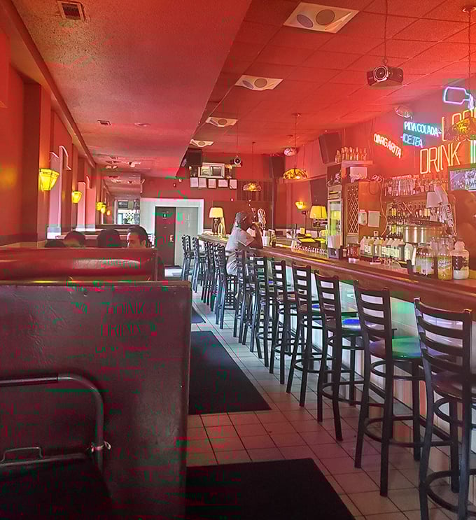 Step inside and the red-hued glow feels like you've entered the VIP section of sandwich heaven, where the bar stools have heard a million Philly stories.