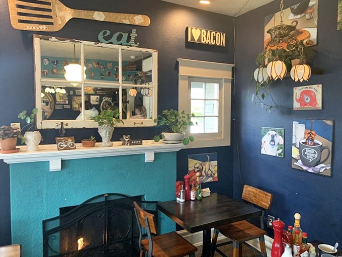 Navy blue walls, quirky art, and an "I ❤️ BACON" sign that speaks universal truth. This isn't decoration—it's a food philosophy.