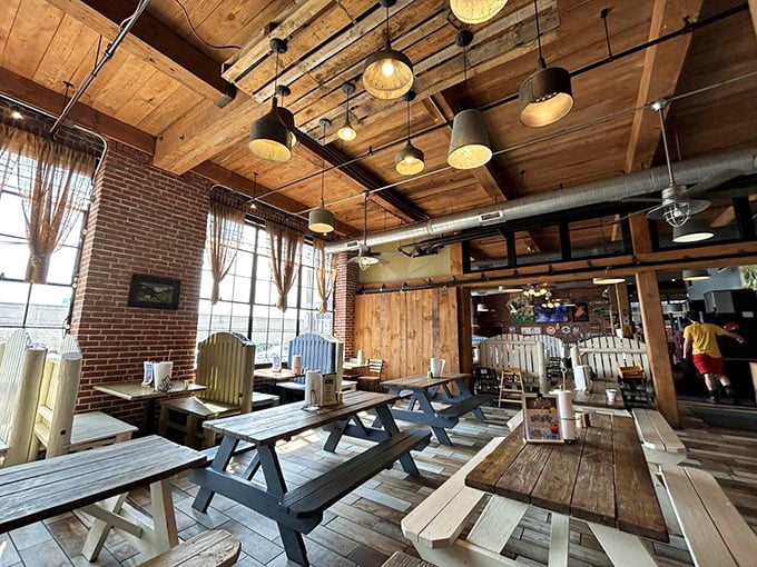 Industrial chic meets backyard comfort – exposed brick and warm wood create the perfect backdrop for meat-induced happiness.
