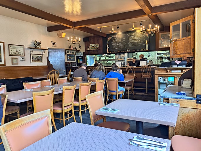 Exposed beams and local artwork create the kind of cozy atmosphere where lingering over breakfast feels absolutely mandatory.