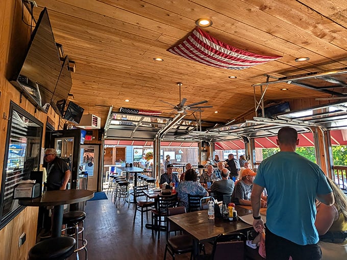 Wooden beams, garage doors that open to summer breezes, and tables filled with locals who know the secret. This isn't ambiance—it's authenticity.
