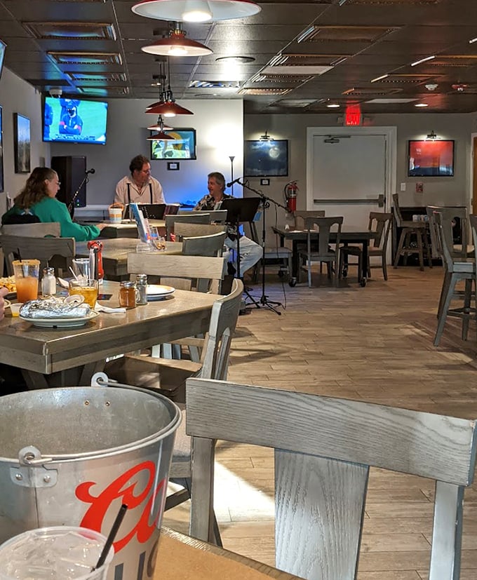 Simple wooden tables and chairs set the stage for seafood drama—no fancy tablecloths needed when the star is this delicious.