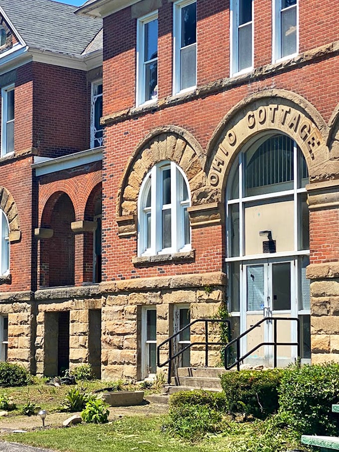 "Old Cottage" carved in stone above arched windows – architectural details that have witnessed nearly two centuries of history in Madison.