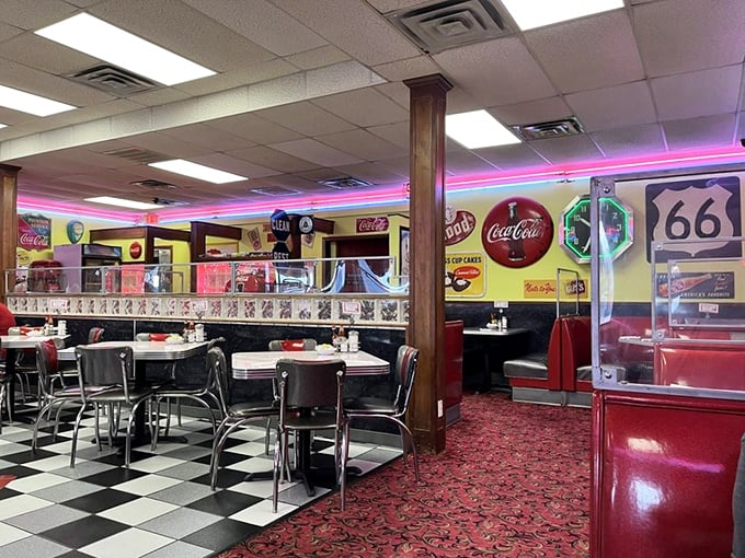 Neon pink lights illuminate chrome and checkerboard floors—this isn't retro by design, it's authentic by survival.