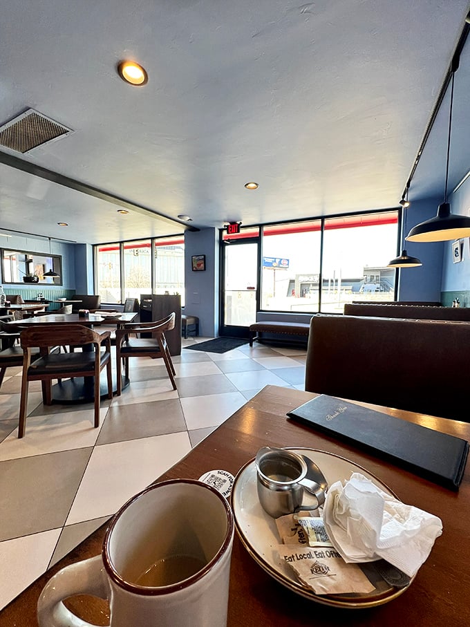 Blue walls and checkered floors create that perfect diner atmosphere where calories don't count and coffee refills are practically mandatory.