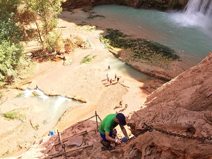 Brave souls navigate the slippery descent while chains provide moral support and actual support in equal measure.
