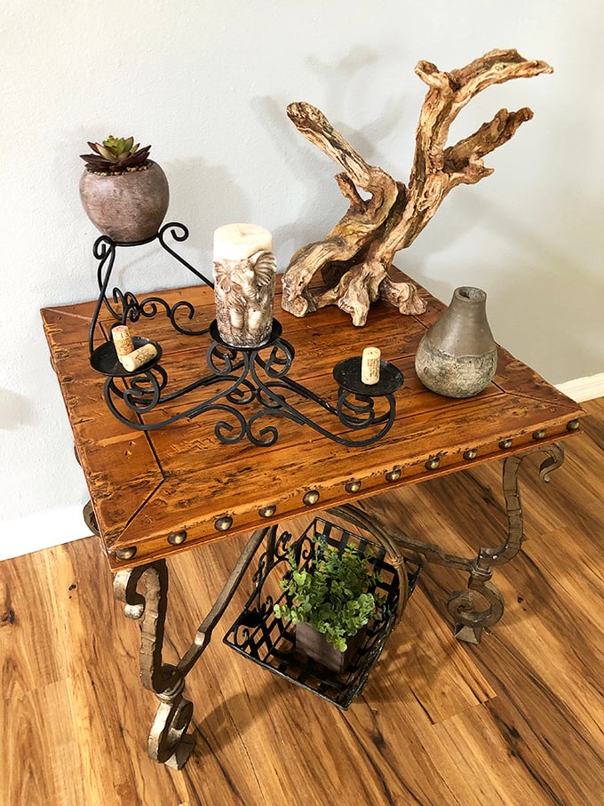 This rustic table tells stories of craftsmanship from another era, adorned with nature-inspired accents that would cost a fortune at designer stores.