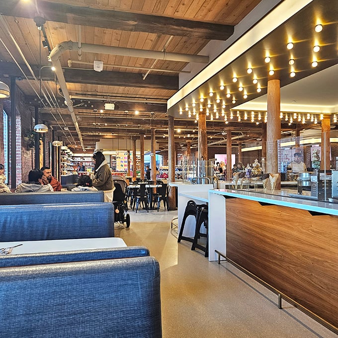 Exposed wooden beams and modern lighting create the perfect backdrop for chocolate contemplation—industrial chic meets confectionery dreams.