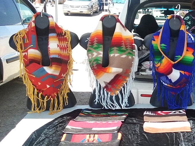 These aren't just scarves—they're wearable Southwest sunsets, each fringe and pattern telling stories that stretch back generations across the high desert.