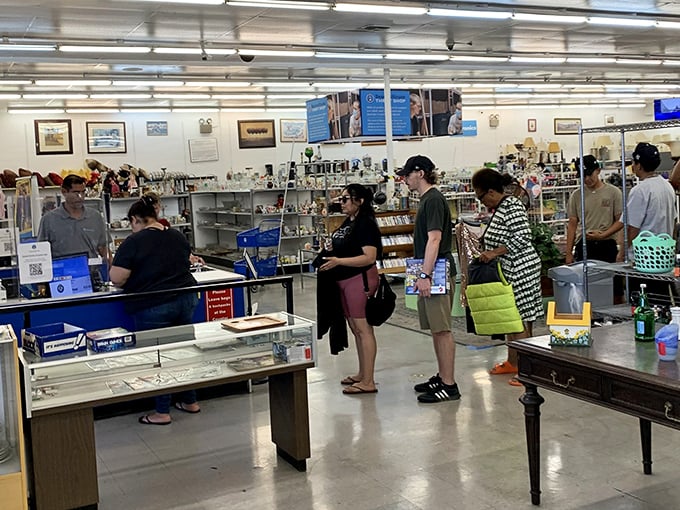 Bargain hunters in their natural habitat. Notice the focused expressions—that's the look of people who've just spotted vintage Pyrex at yard sale prices.