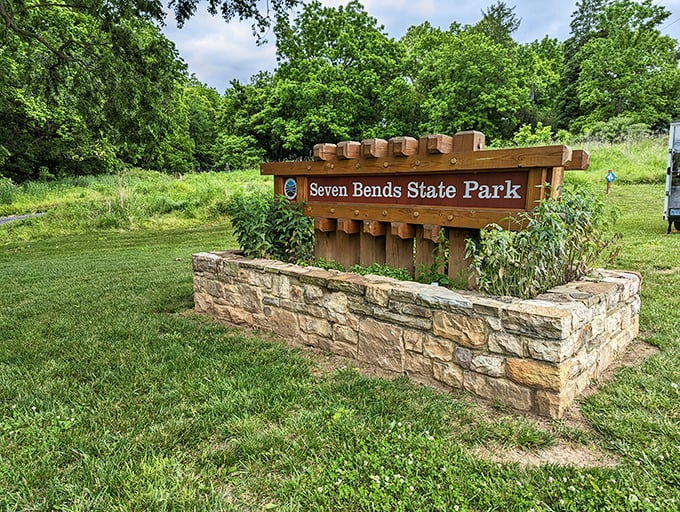 The entrance sign doesn't just say "welcome"—it whispers "slow down, city slicker, the good stuff requires no WiFi password."