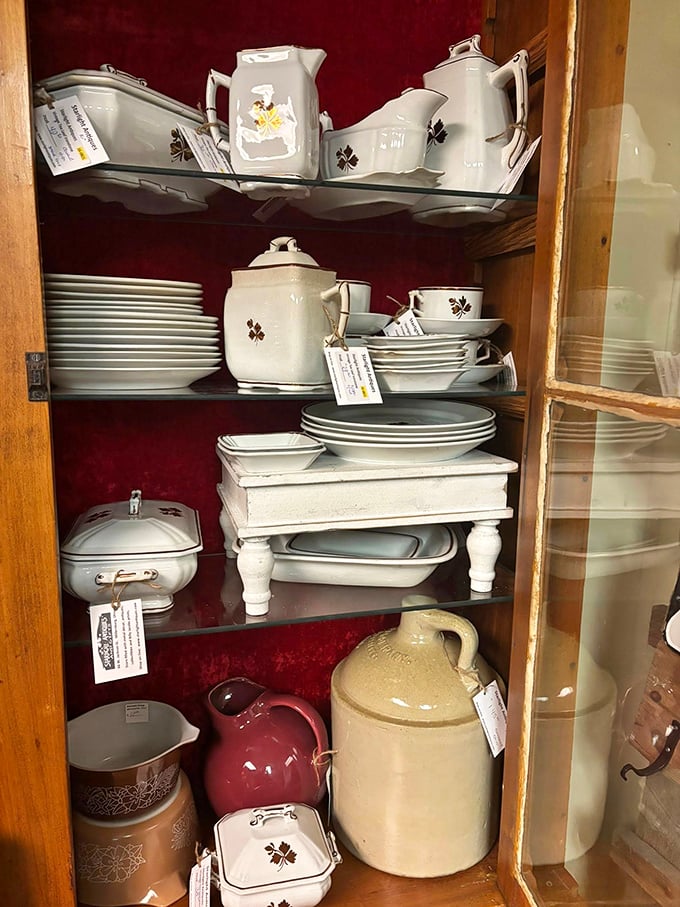 This isn't just dishware—it's a family reunion of porcelain that's survived decades of Sunday dinners. The rich burgundy backdrop makes these white treasures pop like stars.