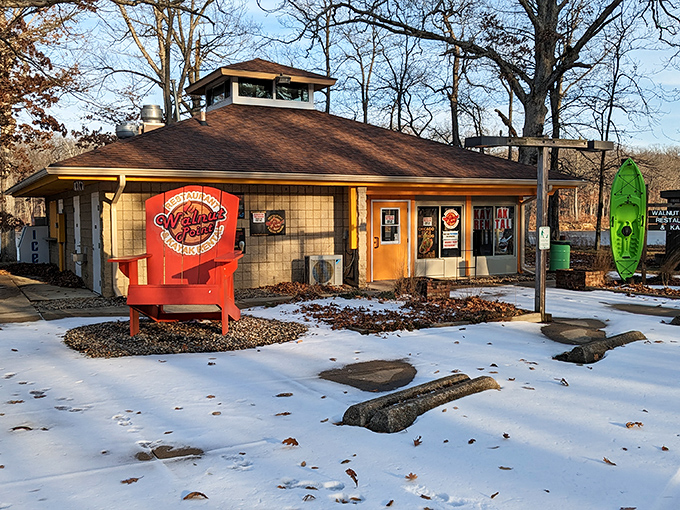 The Walnut Point concession stand, where that oversized red chair isn't compensating for anything – it's just Illinois' way of saying "sit a spell."