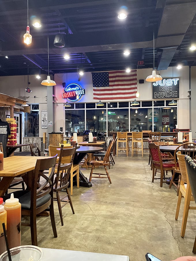 Inside, the "Just Be Nice" neon sign isn't just decor—it's completely unnecessary when the aroma of smoked meats has already put everyone in a good mood.