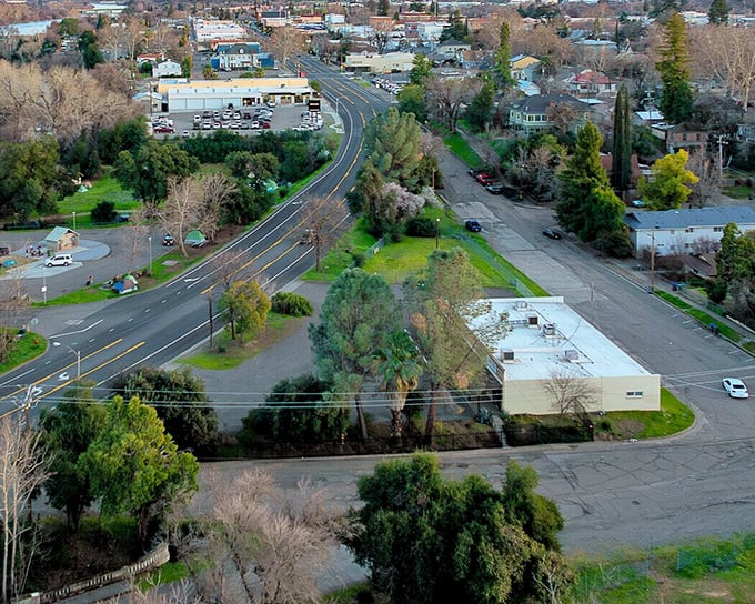 From above, Red Bluff reveals its perfect balance of nature and neighborhood, where streets curve gently into greenery like they're in no particular hurry.