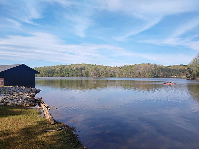 Lake Craig's mirror-like surface doesn't just reflect the sky—it reflects your suddenly diminishing stress levels. That kayaker knows what I'm talking about.