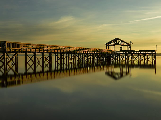 Nature's light show at dusk transforms the ordinary fishing pier into something magical – proof that Mother Nature remains the ultimate Instagram influencer.