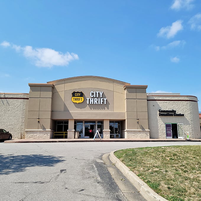 Standing tall under Kansas blue skies, City Thrift's facade is the gateway to bargain paradise. The yellow shield logo practically winks at you: "Come on in, treasures await." 
