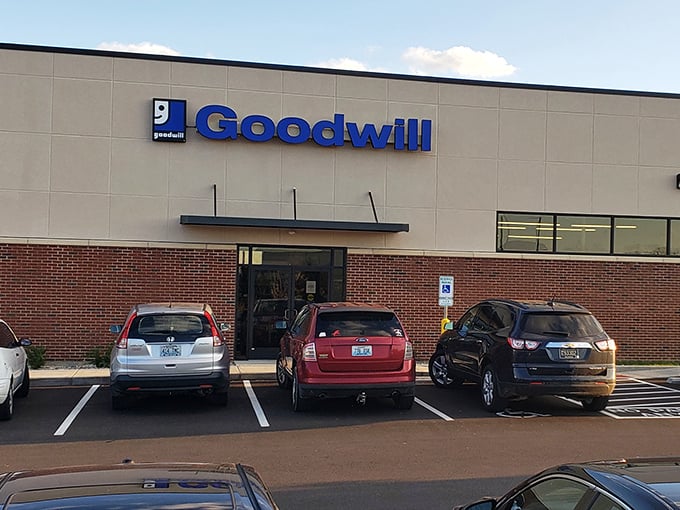 Perfectly lined parking spaces await eager thrifters. That moment before entering when you wonder what forgotten gems might find their way into your life today.