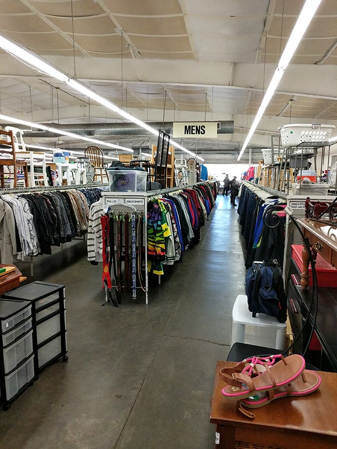 The men's section stretches toward the horizon like a fashion time machine. Here, yesterday's impulse purchases become tomorrow's vintage finds.