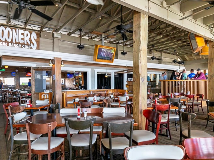 Exposed wooden beams and casual seating create the perfect "no fuss" atmosphere. This isn't dining—it's experiencing Florida as the locals do.