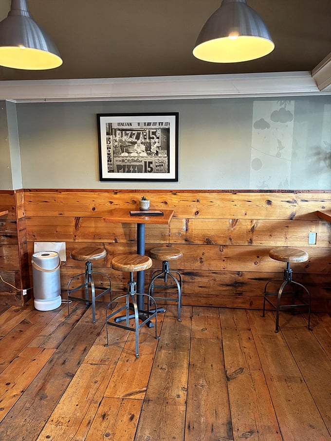 Rustic wooden interiors and industrial-style seating create the perfect backdrop for serious pizza consumption—no distractions, just focus on the food.