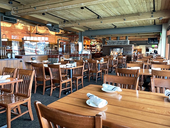 Wooden chairs, warm lighting, and water views create the perfect maritime marriage of comfort and class—like a hug from the sea itself.