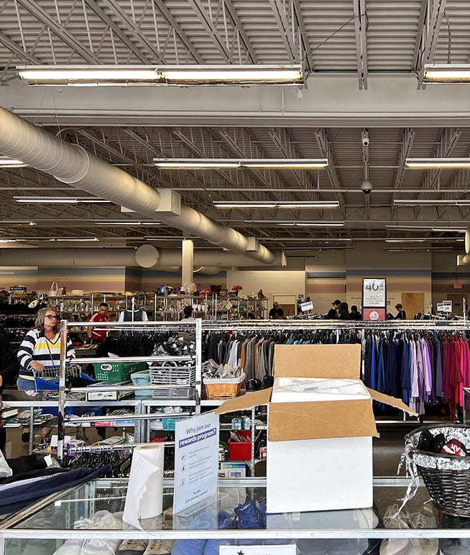 Endless racks stretch toward fluorescent horizons, a wonderland where yesterday's fashion finds tomorrow's admirers at pocket-friendly prices.
