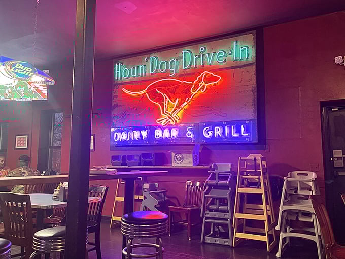 Vintage neon signs cast a nostalgic glow inside Fitz's, where the Houn'Dog Drive-In sign reminds us that good food never goes out of style.