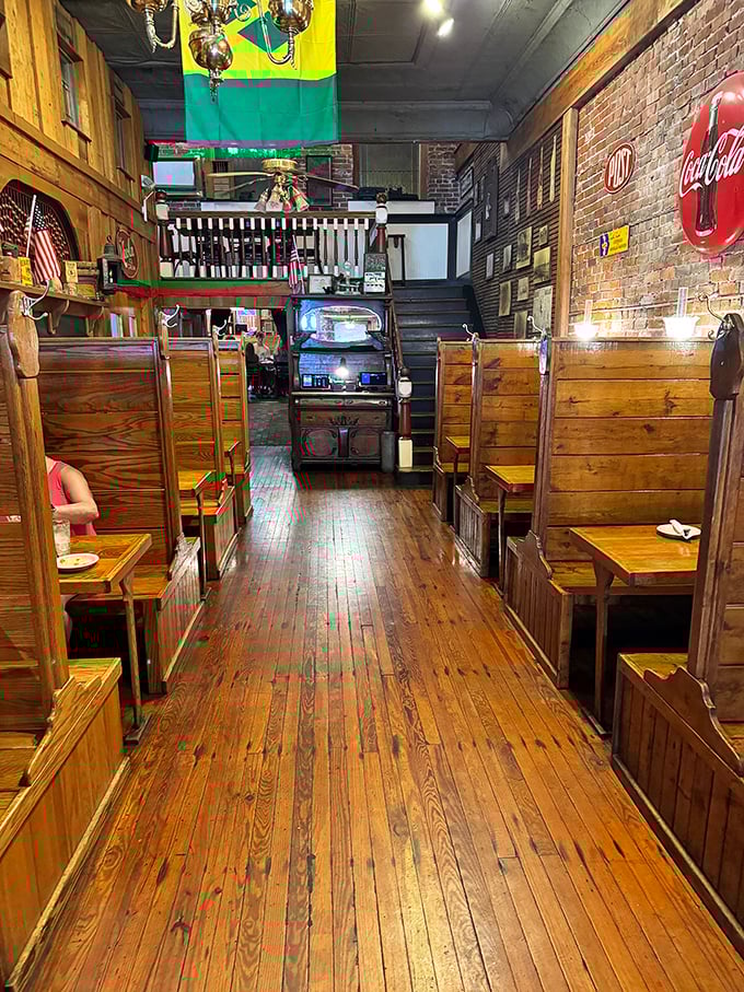Those wooden booths aren't just seating—they're time machines where countless stories have unfolded over plates of fresh seafood and cold drinks.