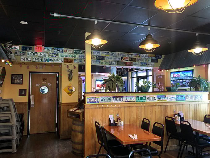 License plates line the walls like trophies of barbecue pilgrims past. Each one tells a story of someone who traveled for that smoky perfection.