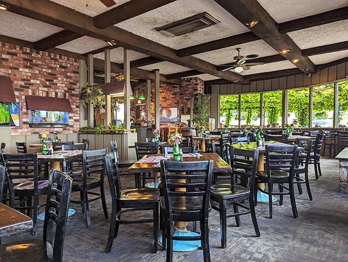 Exposed brick, wooden beams, and natural light—this dining room feels like the galley of a well-loved ship that decided to drop anchor permanently.