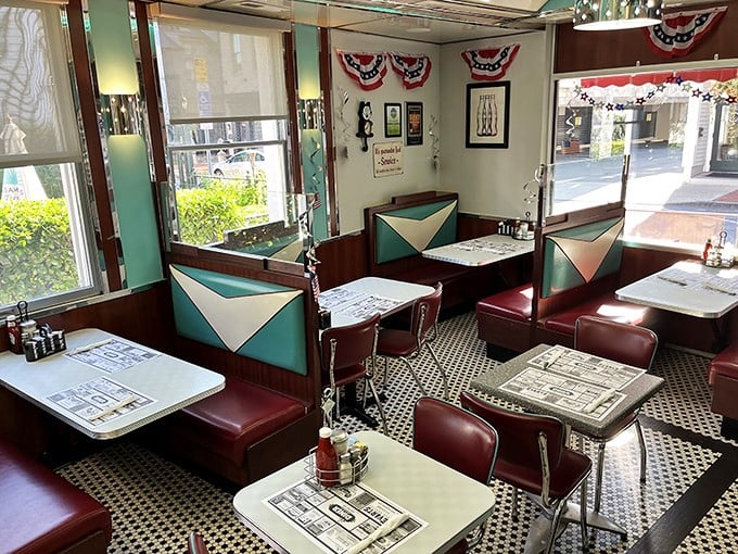 Step back in time with these turquoise and cream vinyl booths. The checkerboard floor and patriotic bunting whisper stories of decades past.