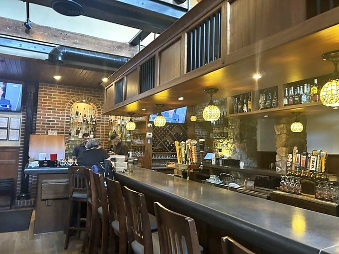The bar at Spring House Tavern isn't just where drinks are served—it's where strangers become friends and regulars become family, all under the glow of those gorgeous pendant lights.