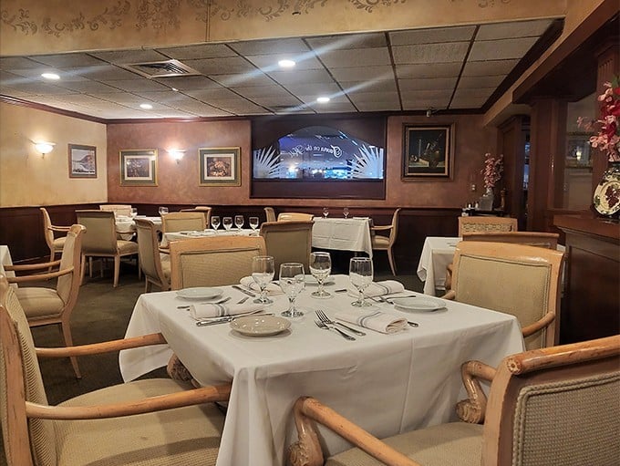 White tablecloths and warm wood tones create that perfect "special occasion that doesn't require a second mortgage" atmosphere.