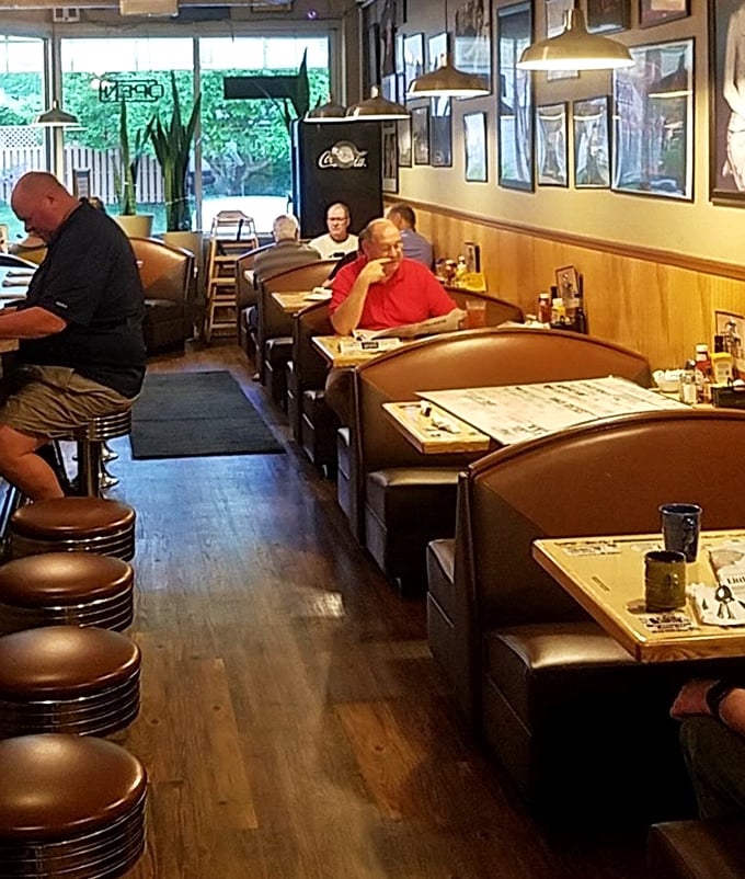Where booths aren't just furniture but front-row seats to the greatest show on earth: everyday Americans breaking bread together without Instagram interruptions.