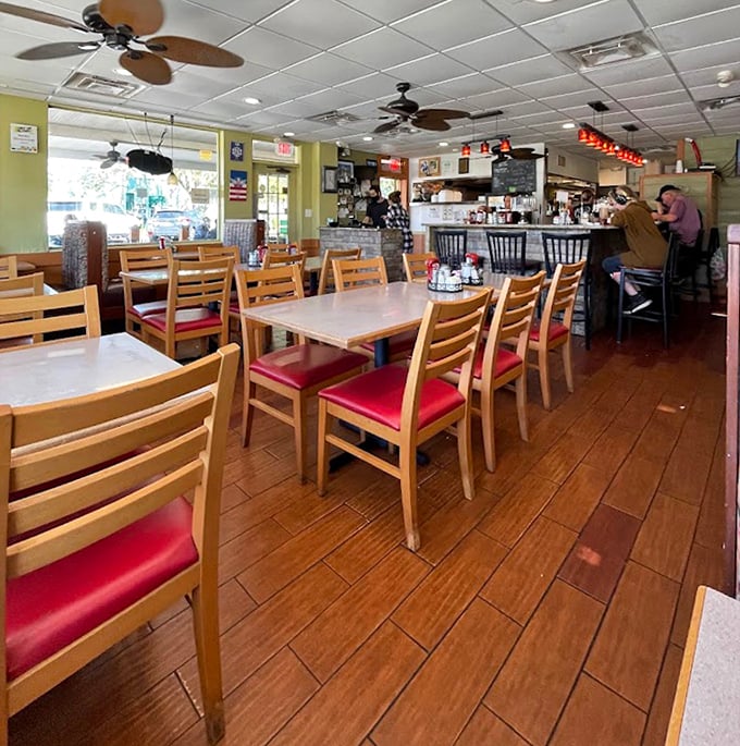 Classic diner charm with wooden chairs and red cushions—where conversations flow as freely as the coffee, and breakfast dreams come true.
