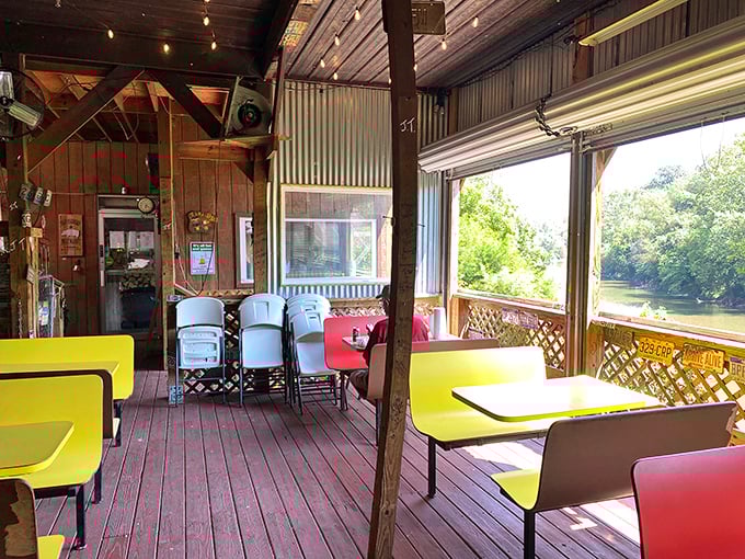 The riverside deck offers yellow tables with a view that rivals the food. Nature and barbecue—West Virginia's perfect pairing.
