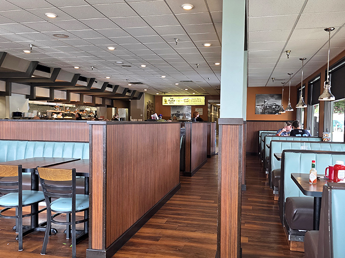 Classic wood-paneled booths create that perfect diner ambiance where conversations flow as freely as the coffee. Nostalgia served with every meal.