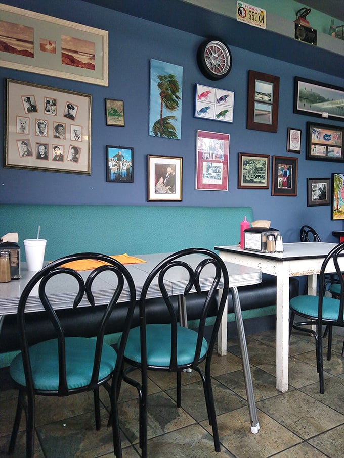 Blue walls adorned with local memorabilia create the perfect backdrop for life-changing burger experiences. No designer needed—just decades of authentic character.