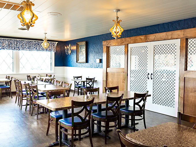 Blue walls and golden chandeliers create that perfect diner ambiance—not too fancy, not too casual, just right for serious pancake business.